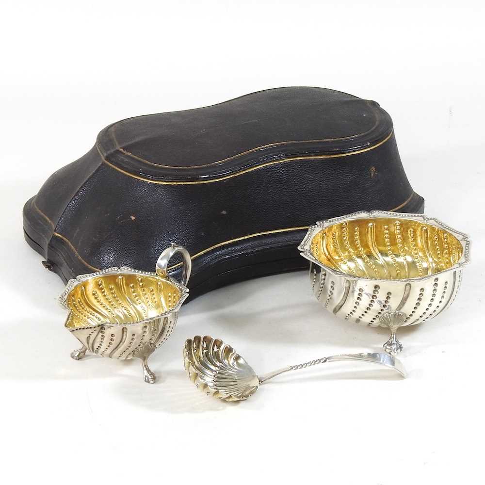 Lot 2 - A Victorian silver and gilt cream set