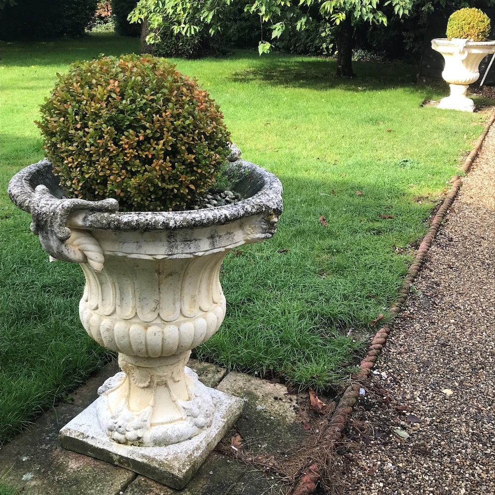 Lot 9 - A pair of large painted cast stone garden urns