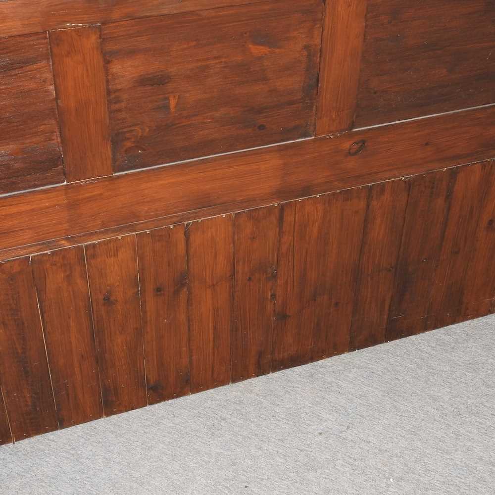 Lot 520 - A stained pine box settle