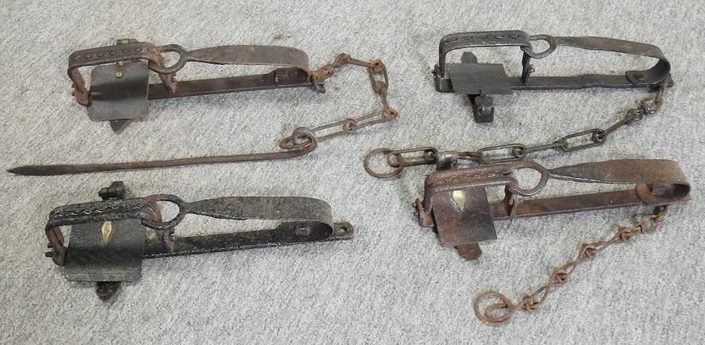 Lot 439 - Eight 19th century iron gin traps