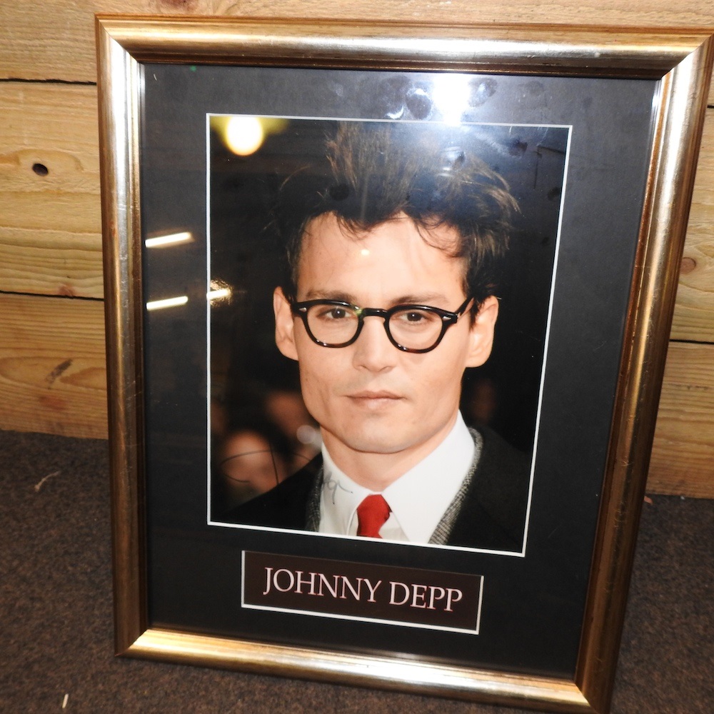 Lot 599 - A signed photograph of Johnny Depp