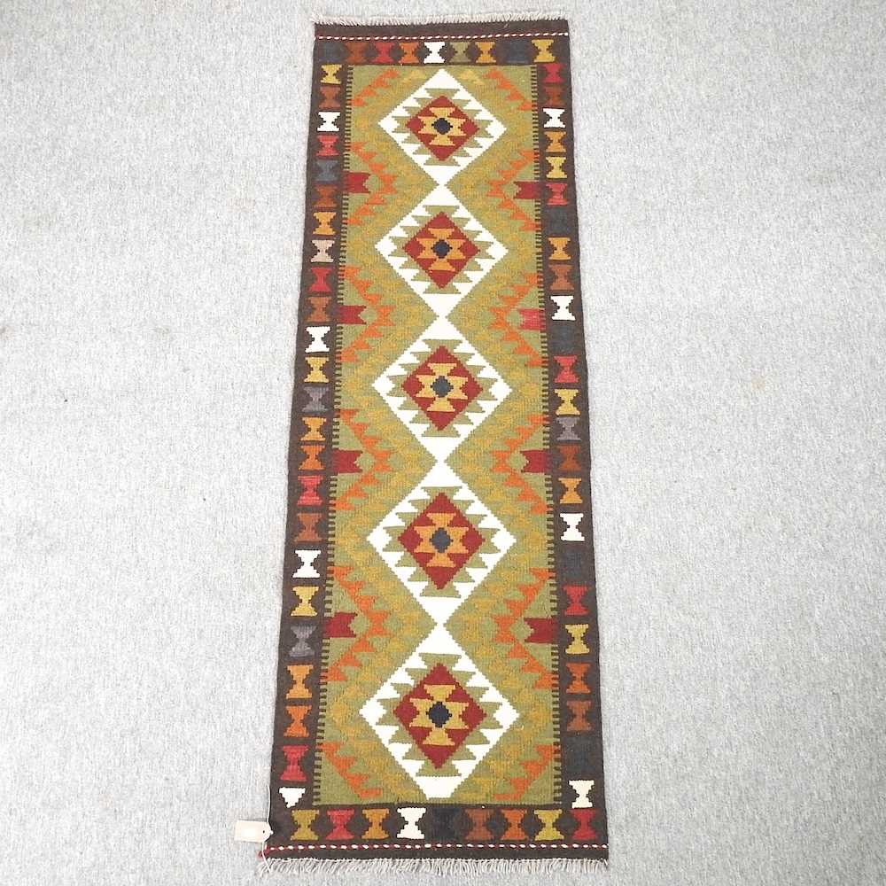 Lot 232 - A Turkish kelim runner