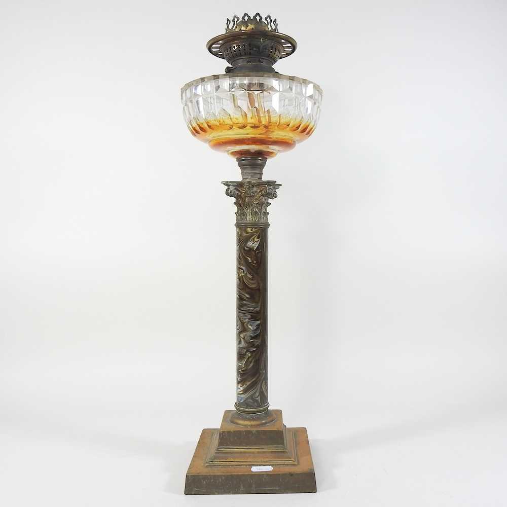 Lot 168 - A 19th century simulated marble oil lamp