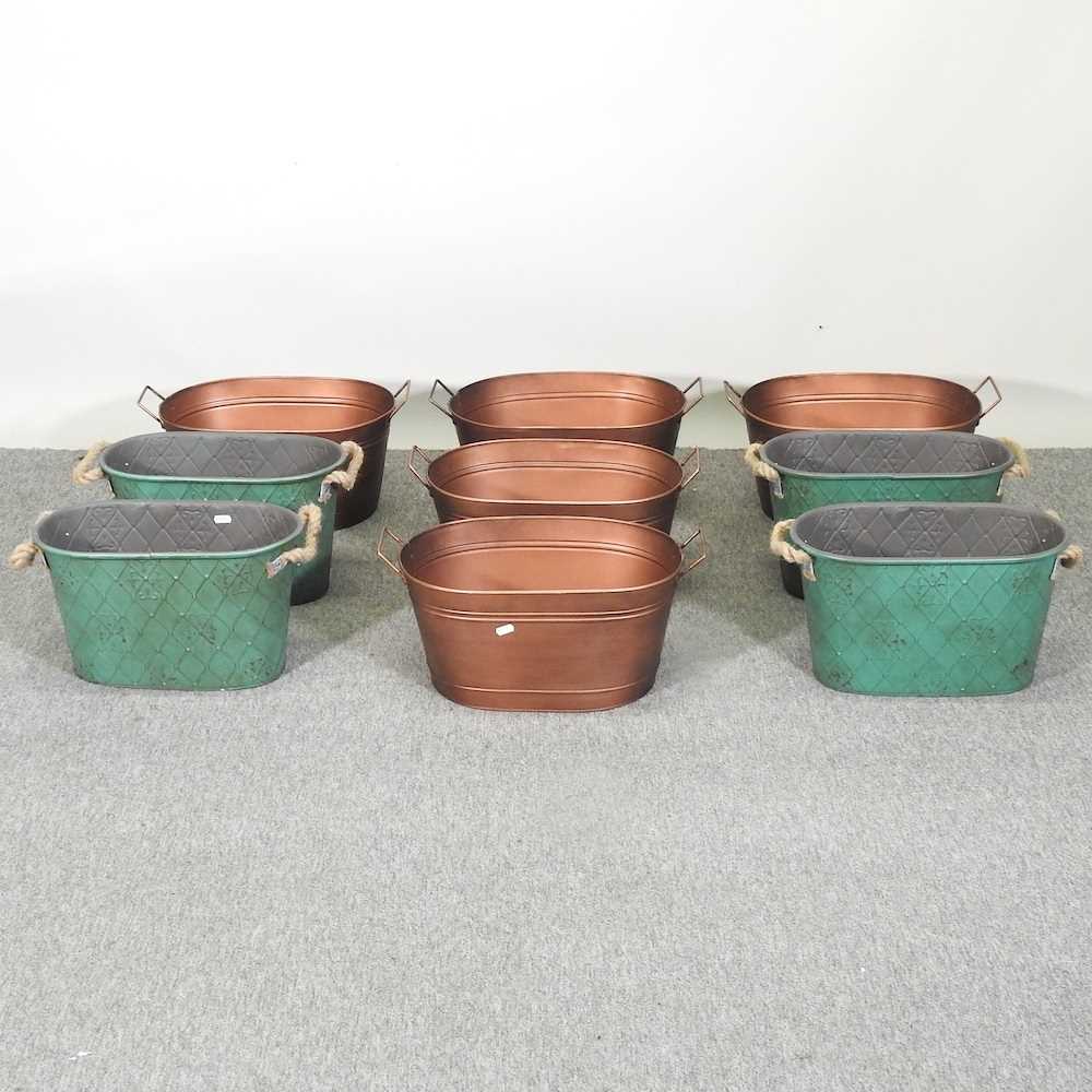 Lot 419 - A set of four copper coloured metal planters