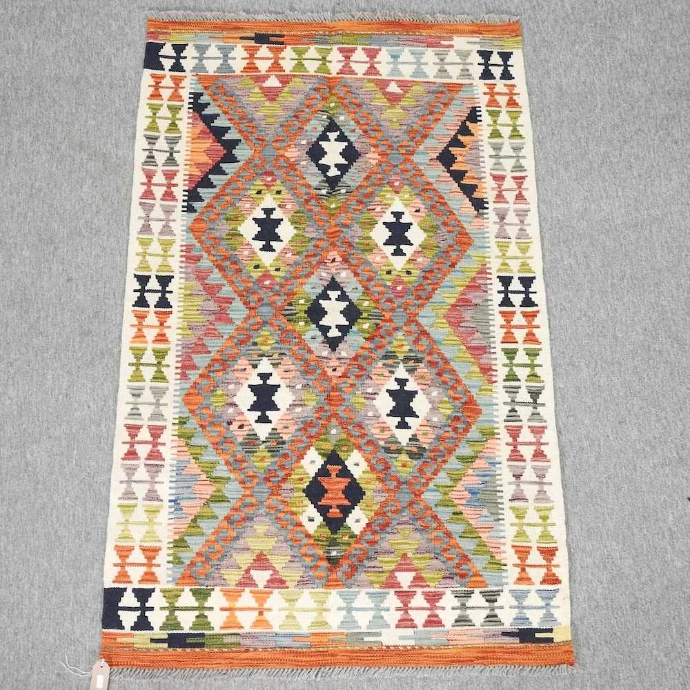 Lot 199 - A kelim rug