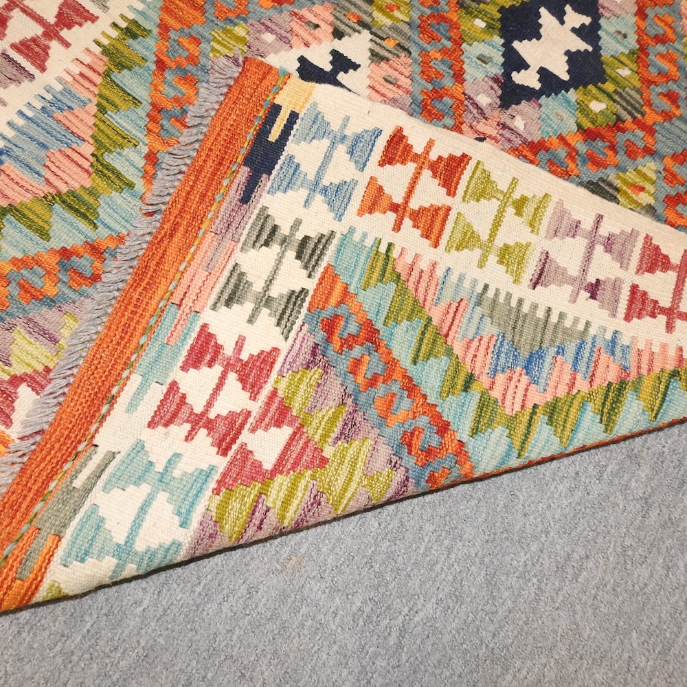 Lot 199 - A kelim rug