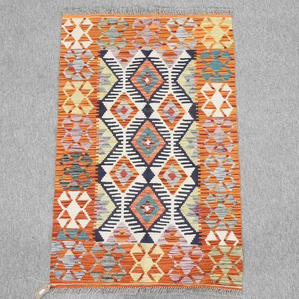Lot 131 - A kelim rug