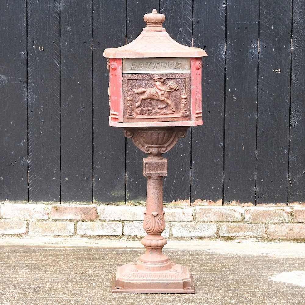 Lot 317 - A cast iron post box
