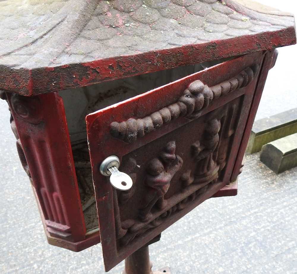 Lot 317 - A cast iron post box