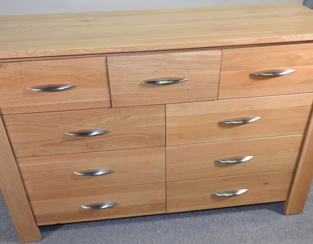 Lot 452 - A modern light oak chest of drawers